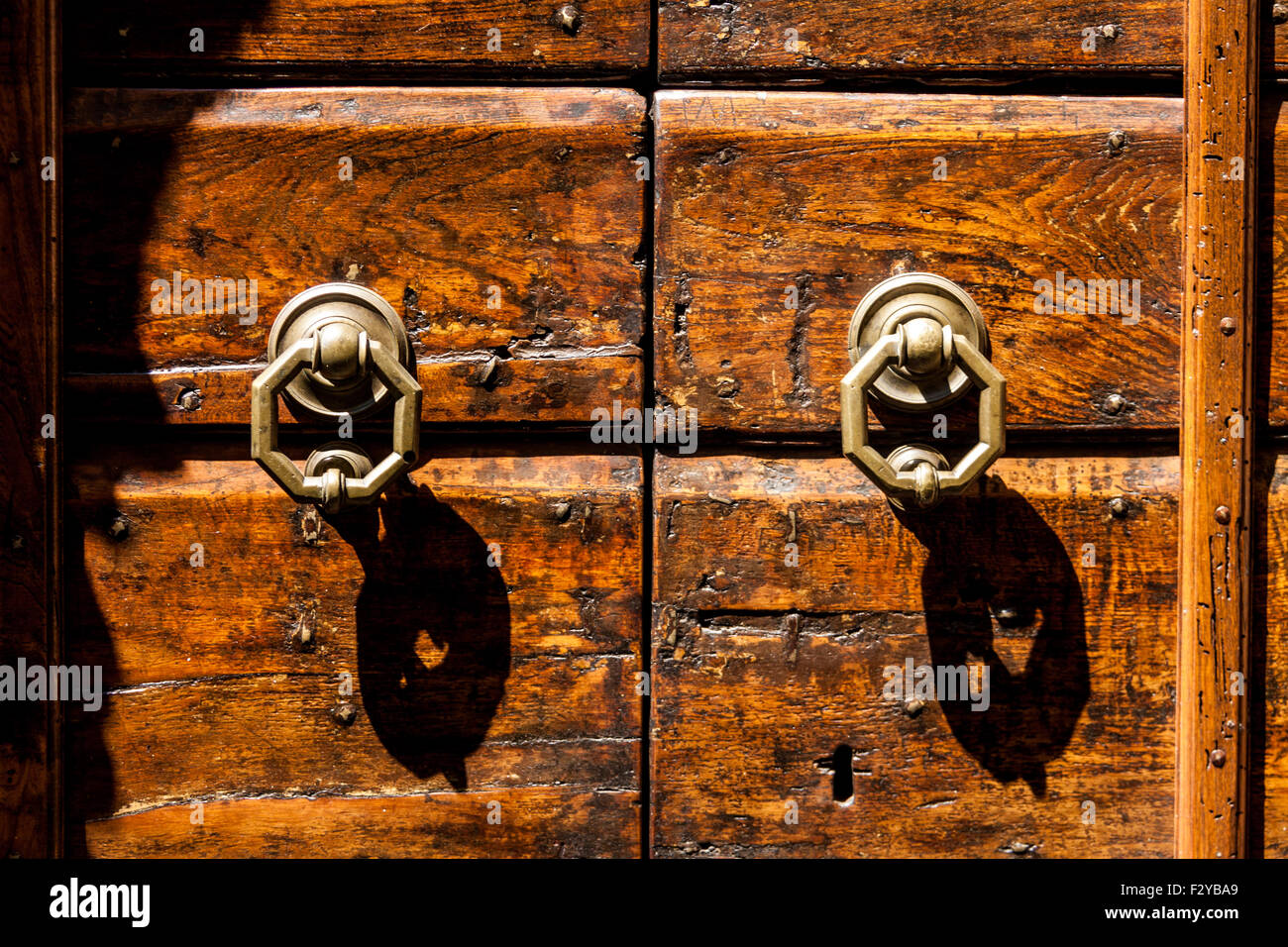 Octagonal door knoker on an old wodden door in Umbria - Italy Stock ...