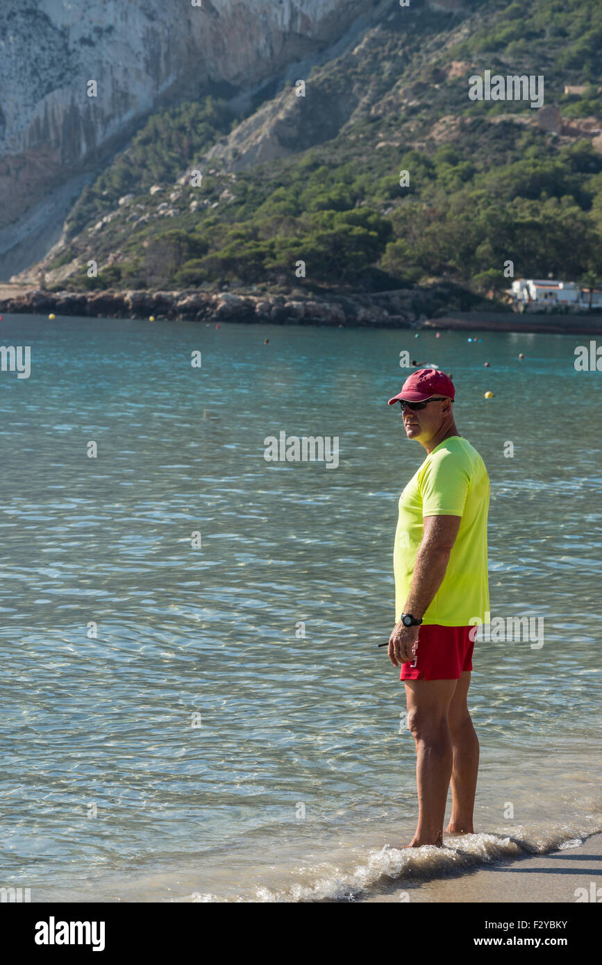 Lifeguard standing on the shore of a beach resort Stock Photo - Alamy