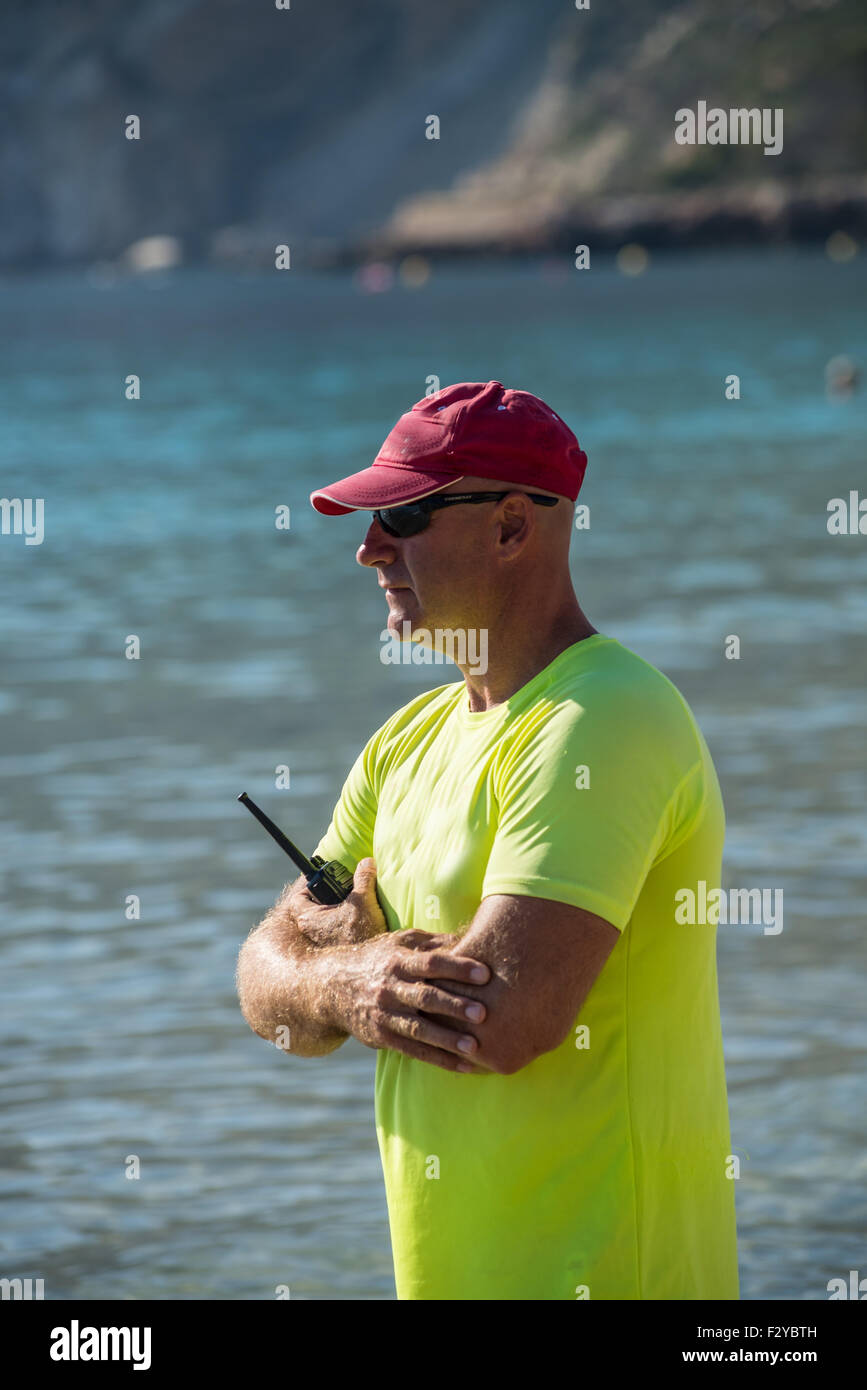 Lifeguard standing on the shore of a beach resort Stock Photo - Alamy