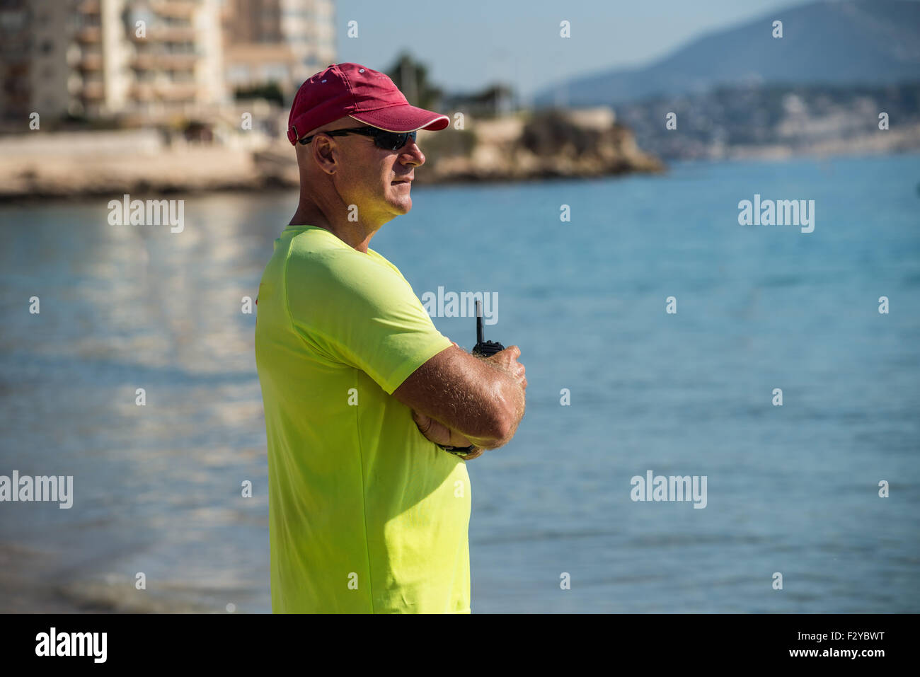 Lifeguard standing on the shore of a beach resort Stock Photo - Alamy