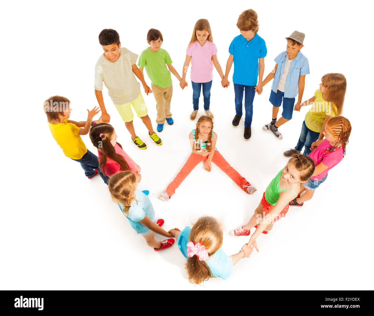 Girl sit on the floor with friends encircle her Stock Photo - Alamy