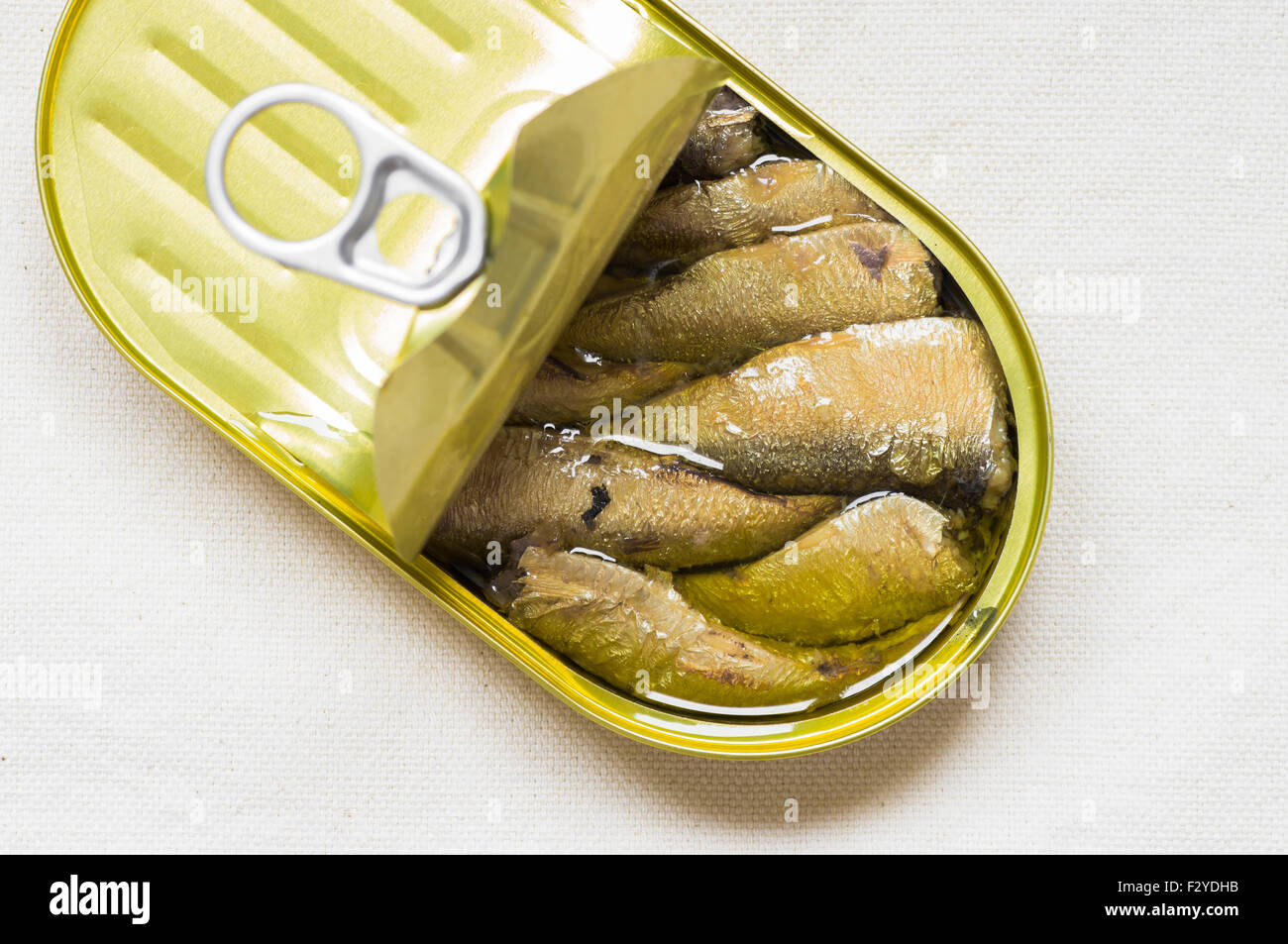 Sardines in a tin oval top view Stock Photo - Alamy