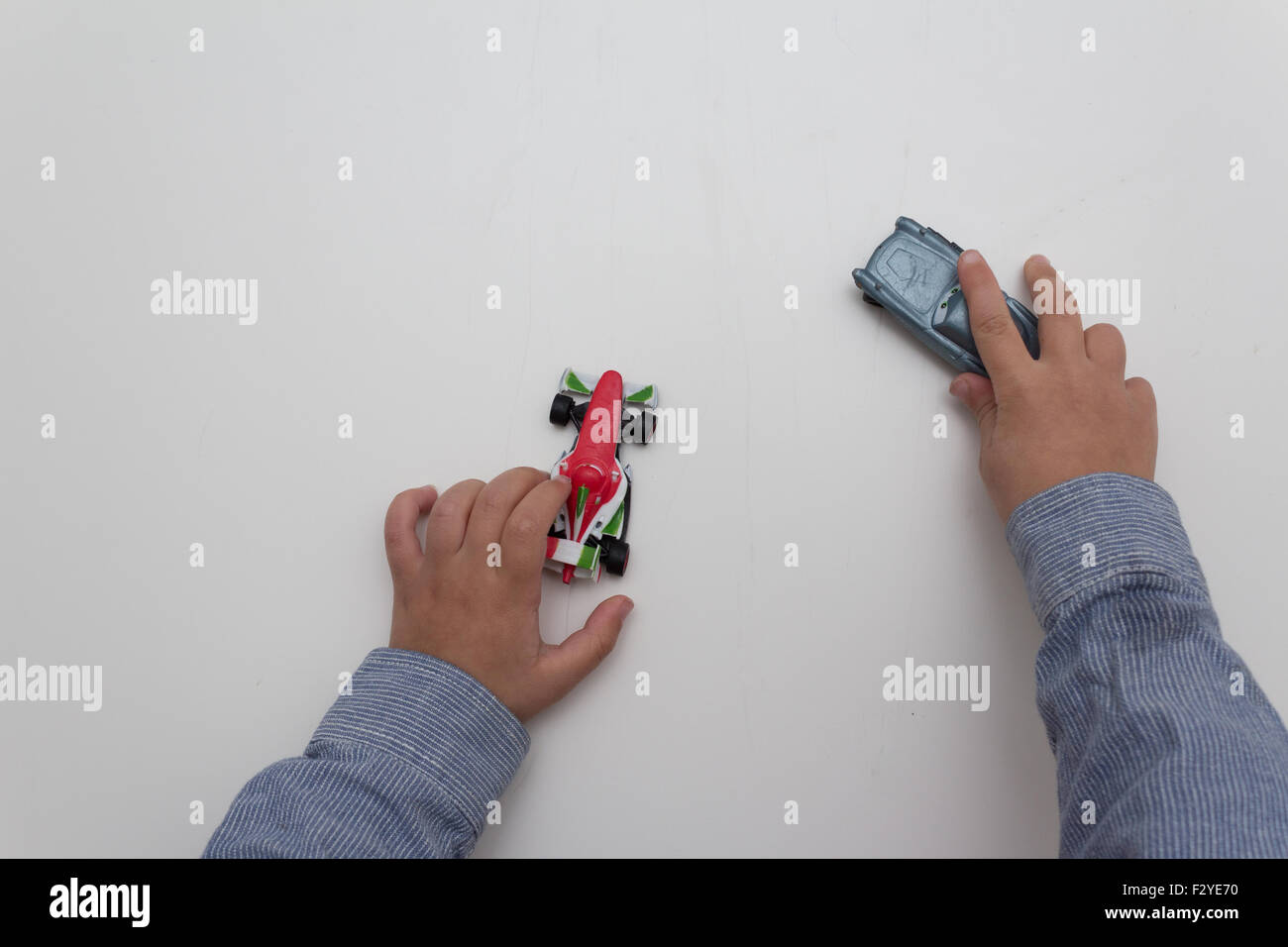 child hands isolated playing with cars on white background Stock Photo ...