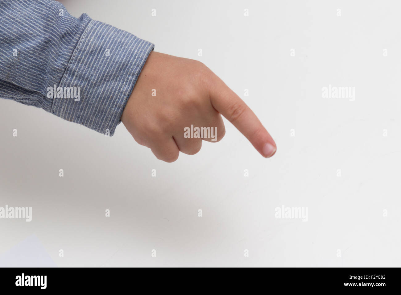 child hand pointing finger isolated on white background Stock Photo - Alamy