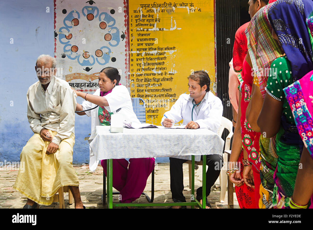 indian rural Villager group crowds Medical Dispensary Checking Stock ...
