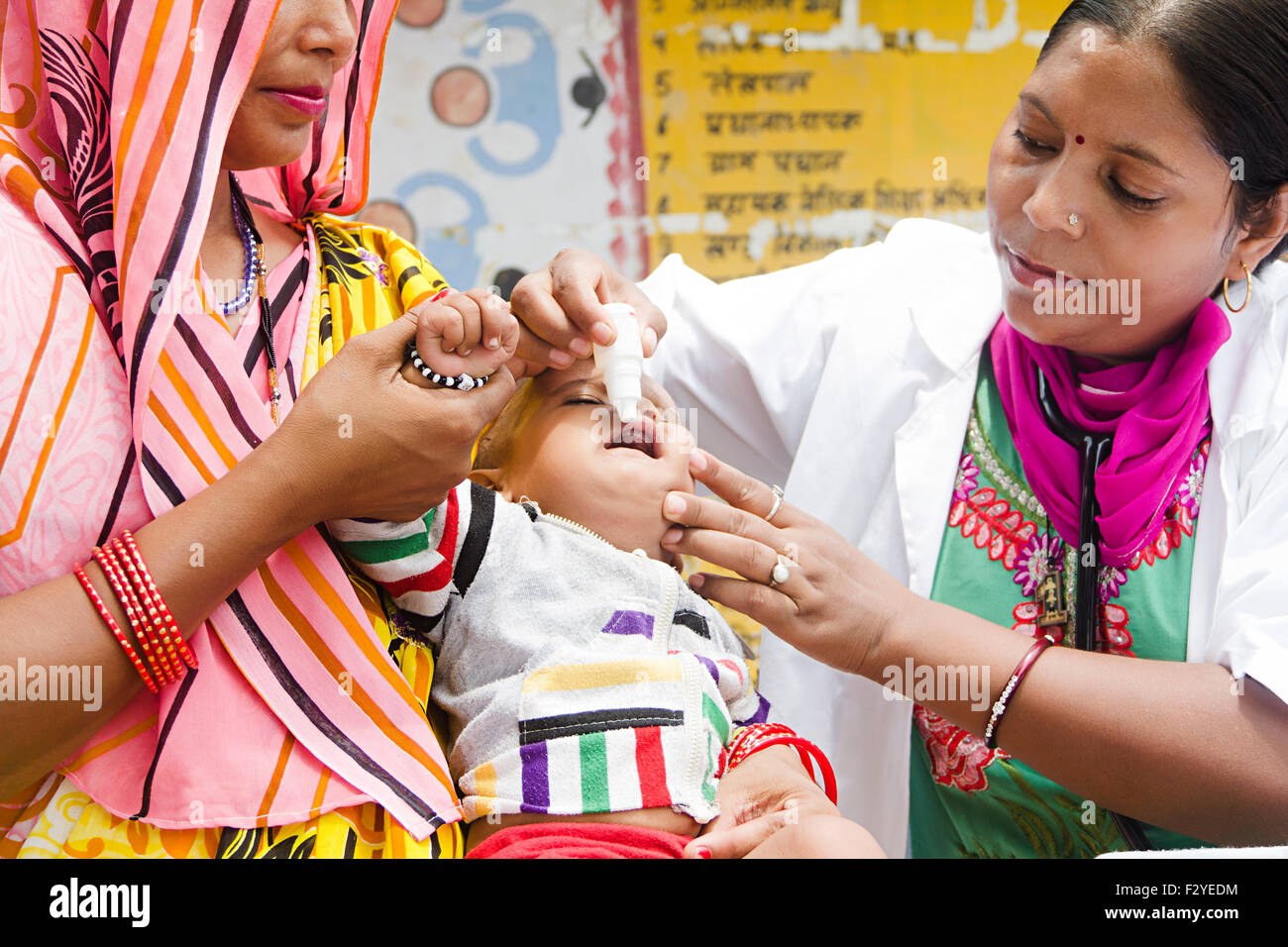 3 indian Rural Villager woman Medical Dispensary Polio Drops kids Stock ...