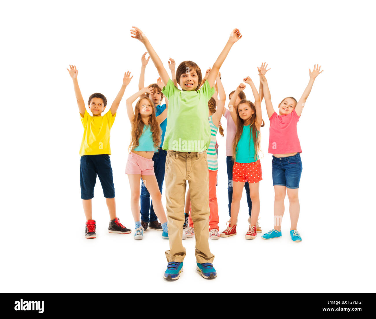 Happy school children raised hands hi-res stock photography and images ...