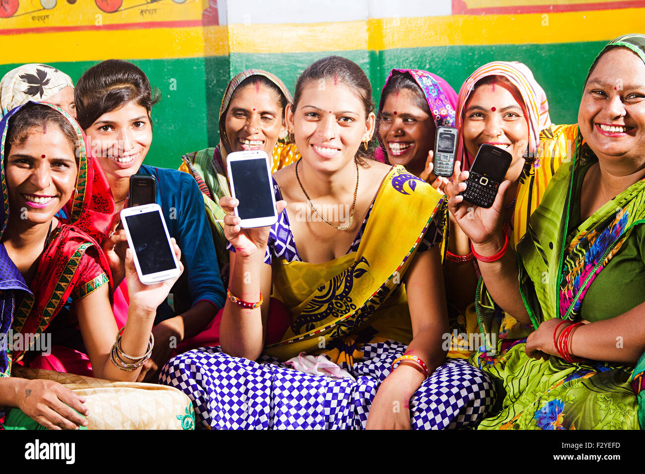 indian rural Villager group crowds womans Quality Mobile Phone showing ...