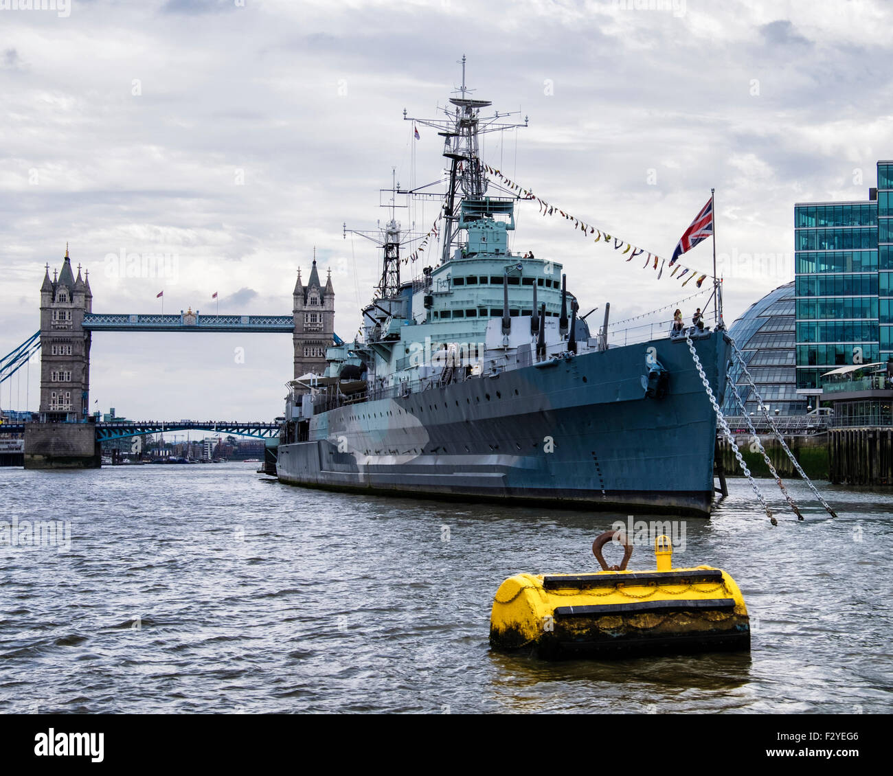 Tower Bridge & HMS Belfast - Historic old battleship moored on the ...