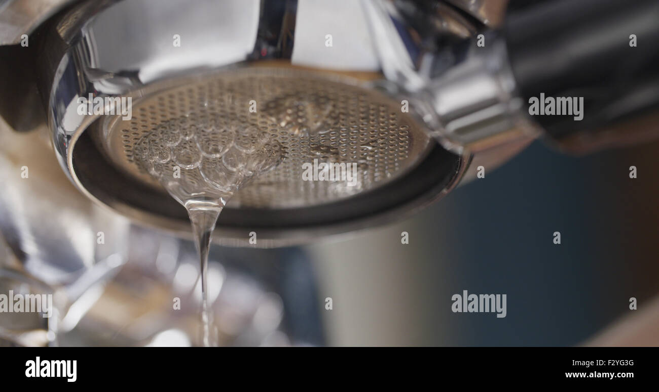 rinsing coffee machine before pouring coffee Stock Photo - Alamy