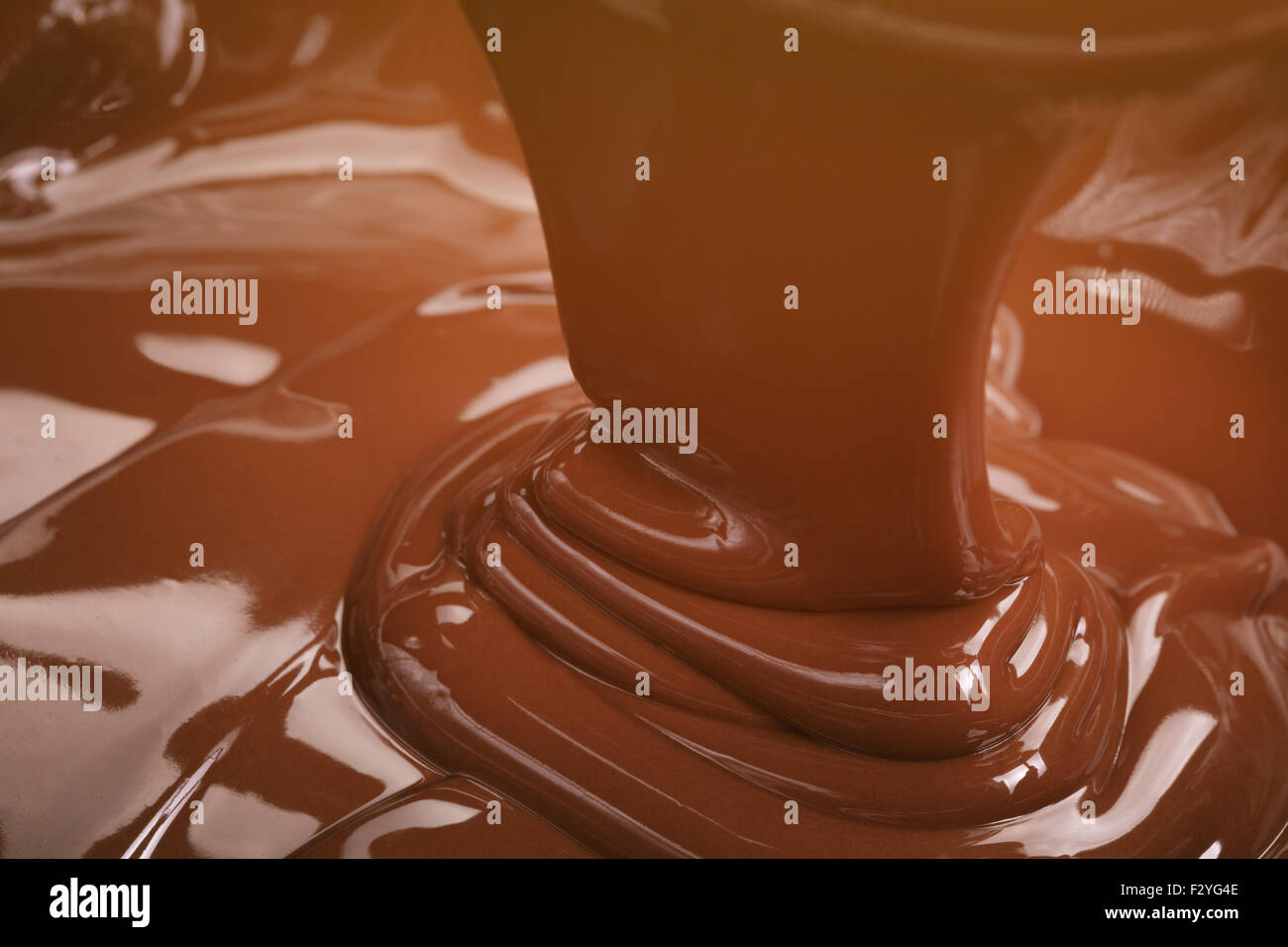 close up photo of dark chocolate flow Stock Photo - Alamy