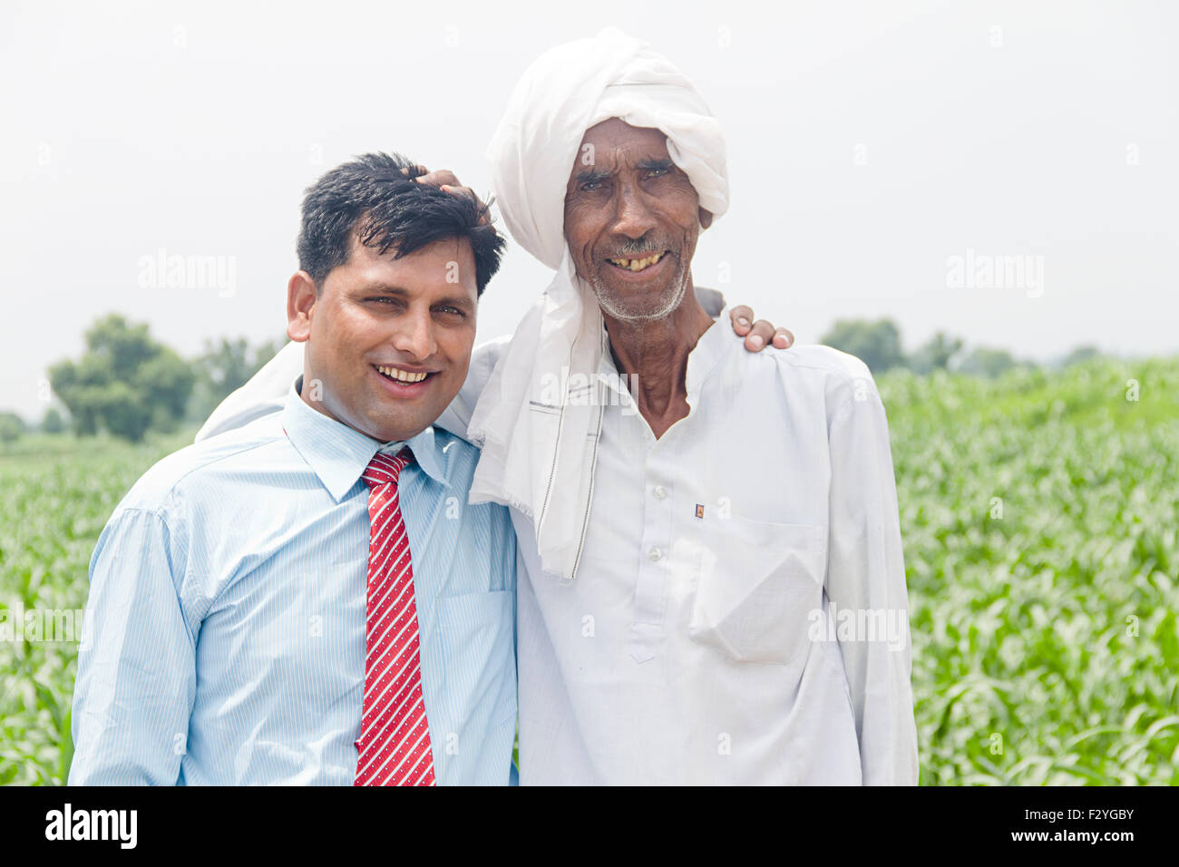 2 indian Business Man and rural farmer farm standing Stock Photo - Alamy