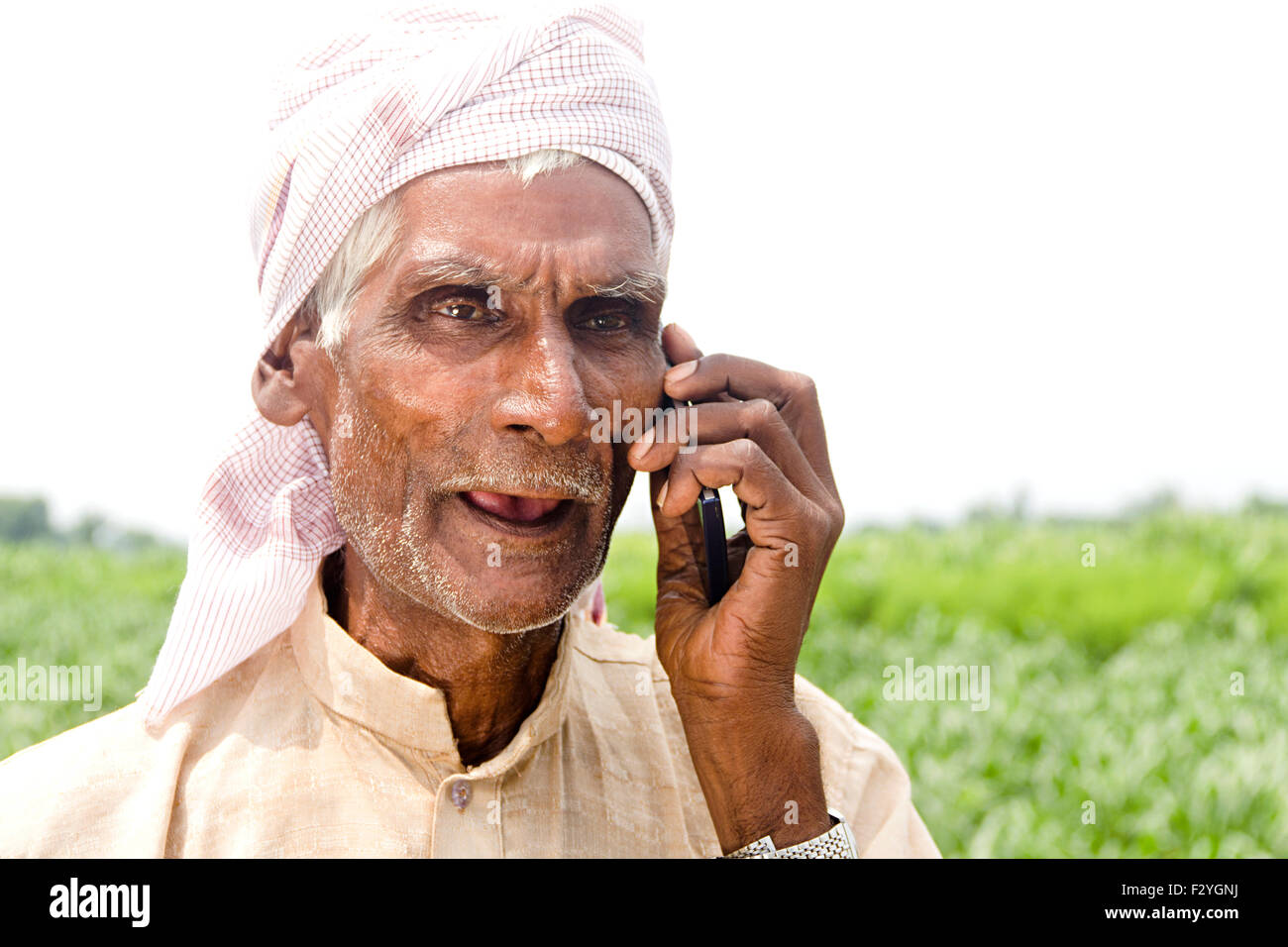 1 indian rural Senior farmer farm Talking Mobile Phone Stock Photo - Alamy