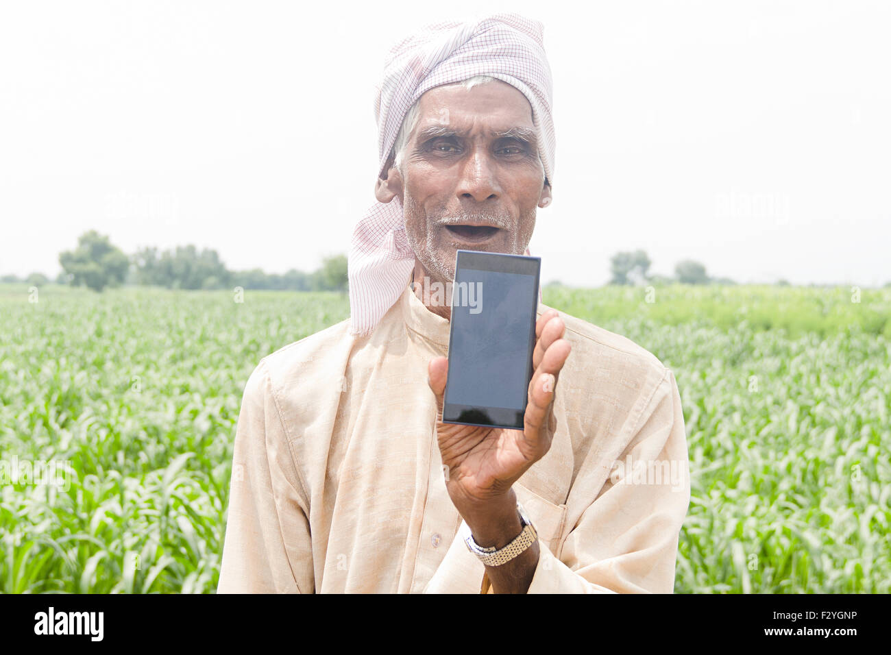 Showing mobile phone farm village hi-res stock photography and images ...