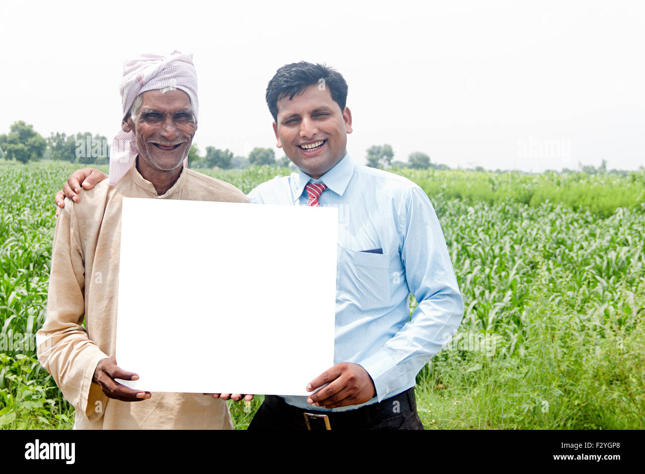 2 indian rural Business Man and farmer farm Message Board showing Stock ...