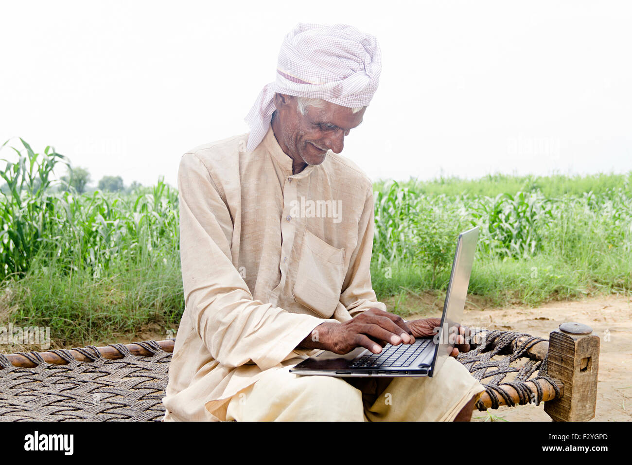 1 indian rural Senior farmer farm laptop Working Stock Photo - Alamy