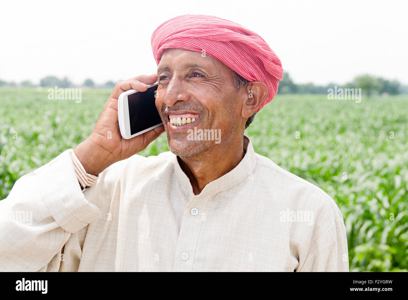 1 indian rural Senior farmer farm Talking Mobile Phone Stock Photo - Alamy