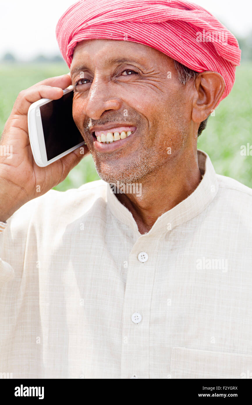 1 indian rural Senior farmer farm Talking Mobile Phone Stock Photo - Alamy