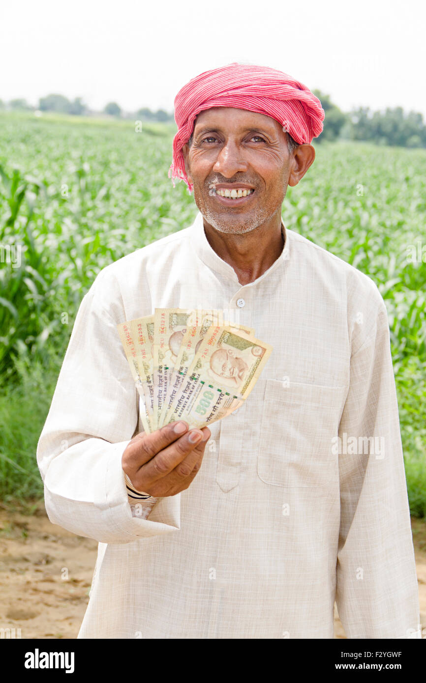1 indian rural Senior farmer farm money showing Stock Photo - Alamy