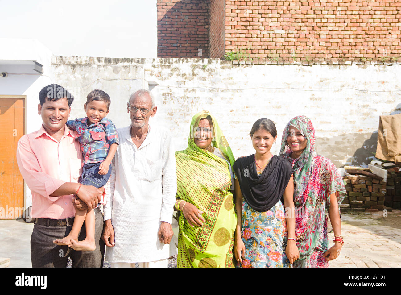 indian group crowds rural villager family home standing Stock Photo - Alamy