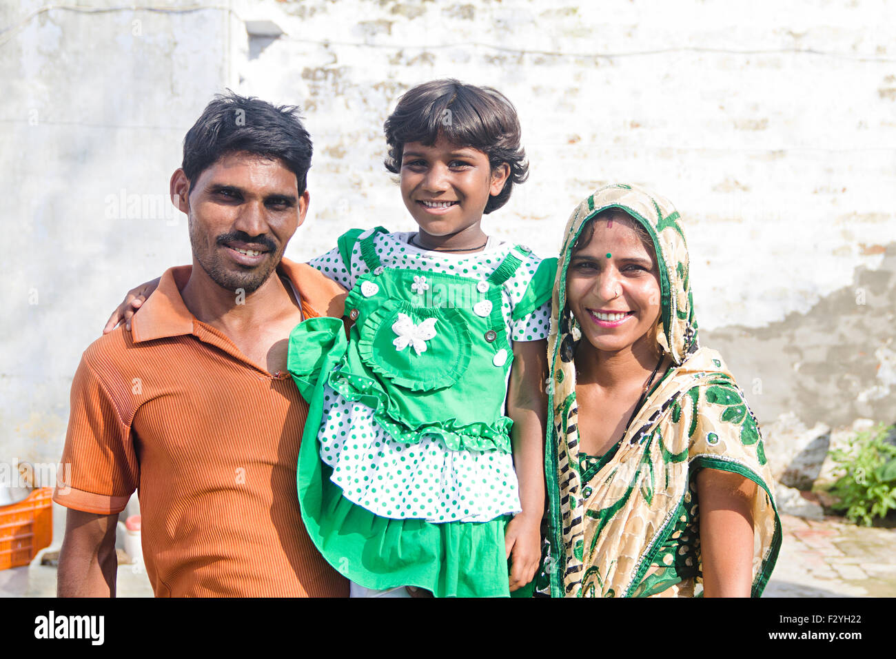 3 indian rural villager Parents and kids standing home Stock Photo - Alamy