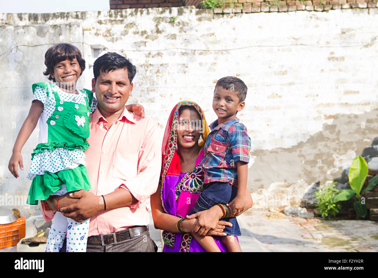 4 indian rural villager Parents and kids standing home Stock Photo - Alamy