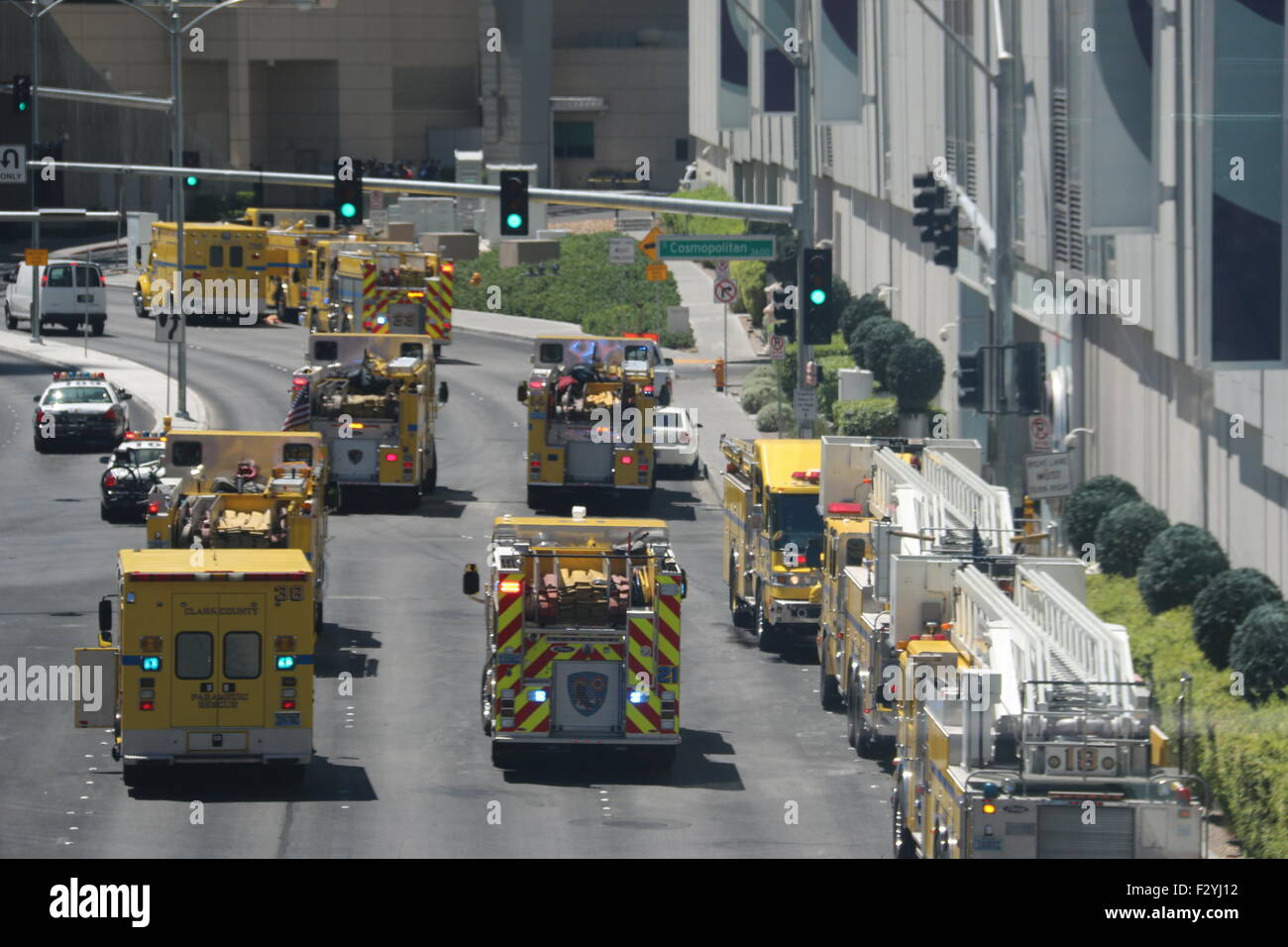 Emergency services attend to a fire that broke out on the 14th floor of ...