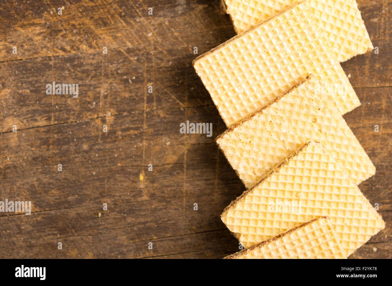 Closeup square cookies lying overlapping each other in a row across ...