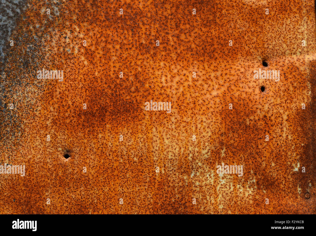 Old vintage bright rust stained corroded metal surface with dark ...