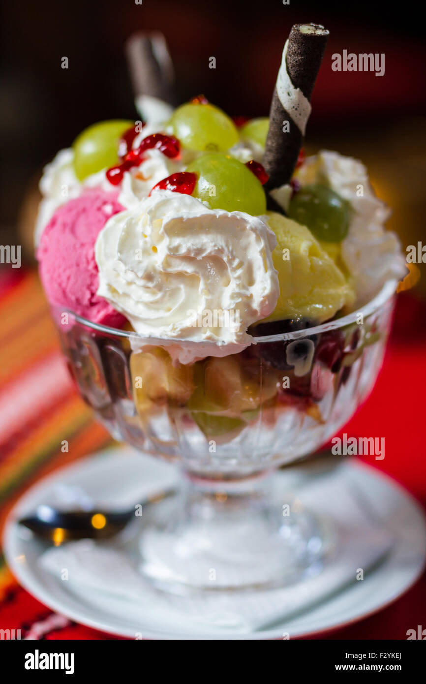 Delicious vanilla sundae with strawberry shoot with short DOF Stock ...