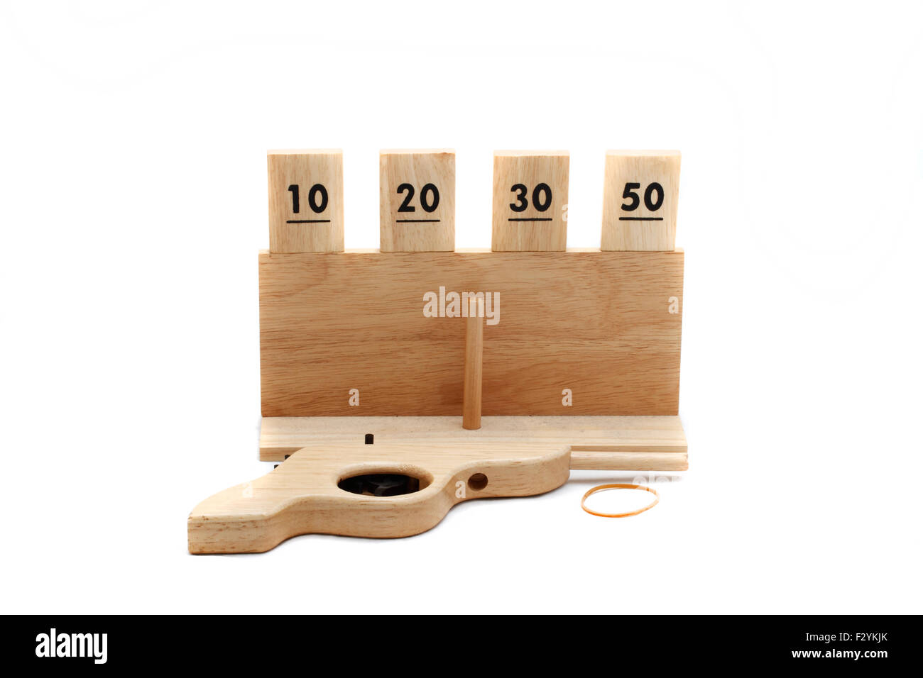 Wooden elastic band firing gun and target set Stock Photo - Alamy