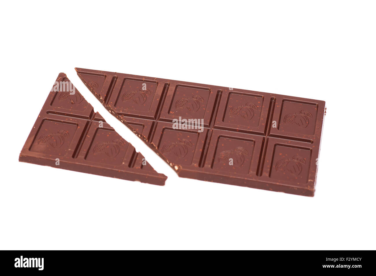 Broken chocolate bar on a white background Stock Photo - Alamy