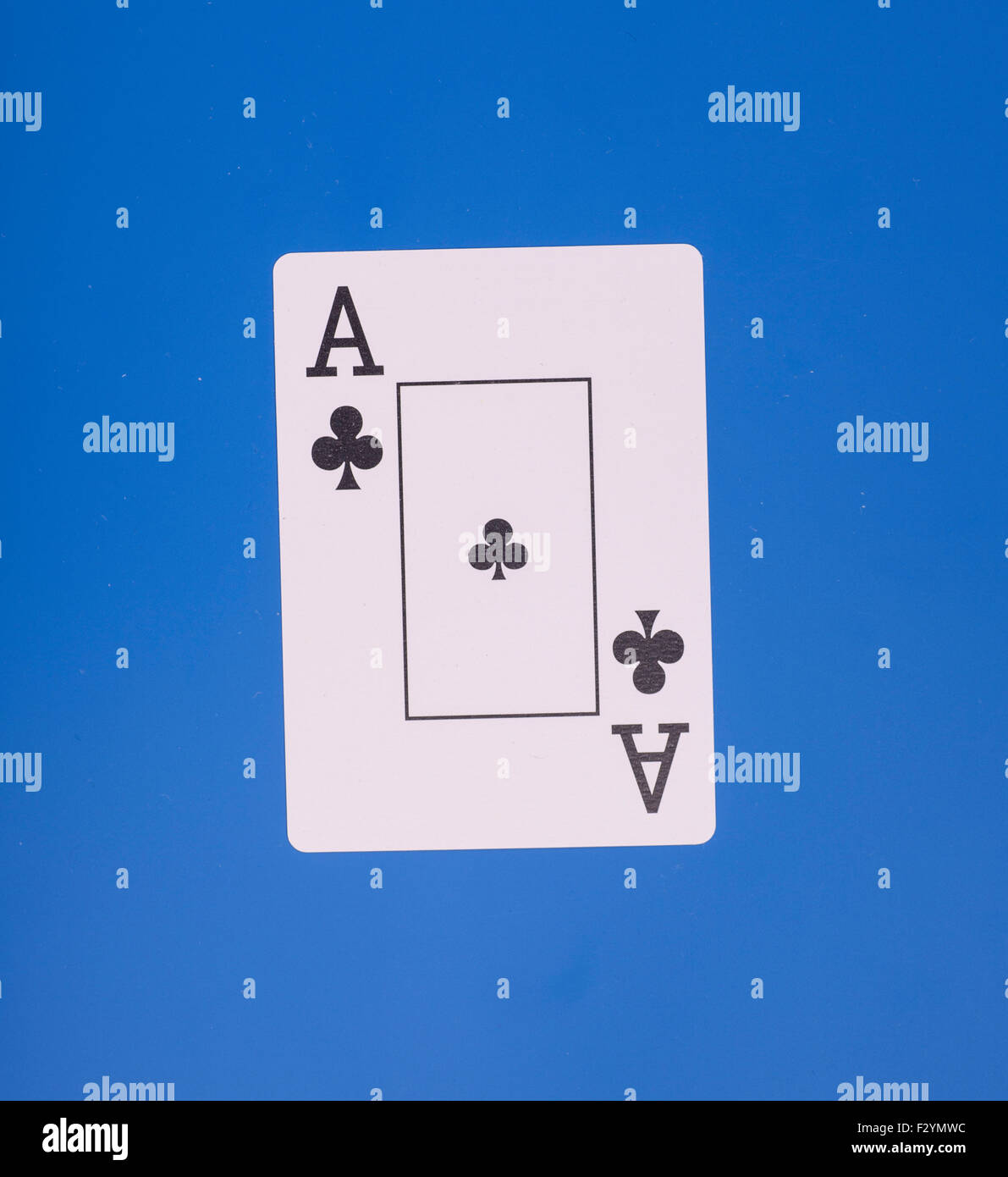 Ace of Clubs on blue background Stock Photo - Alamy