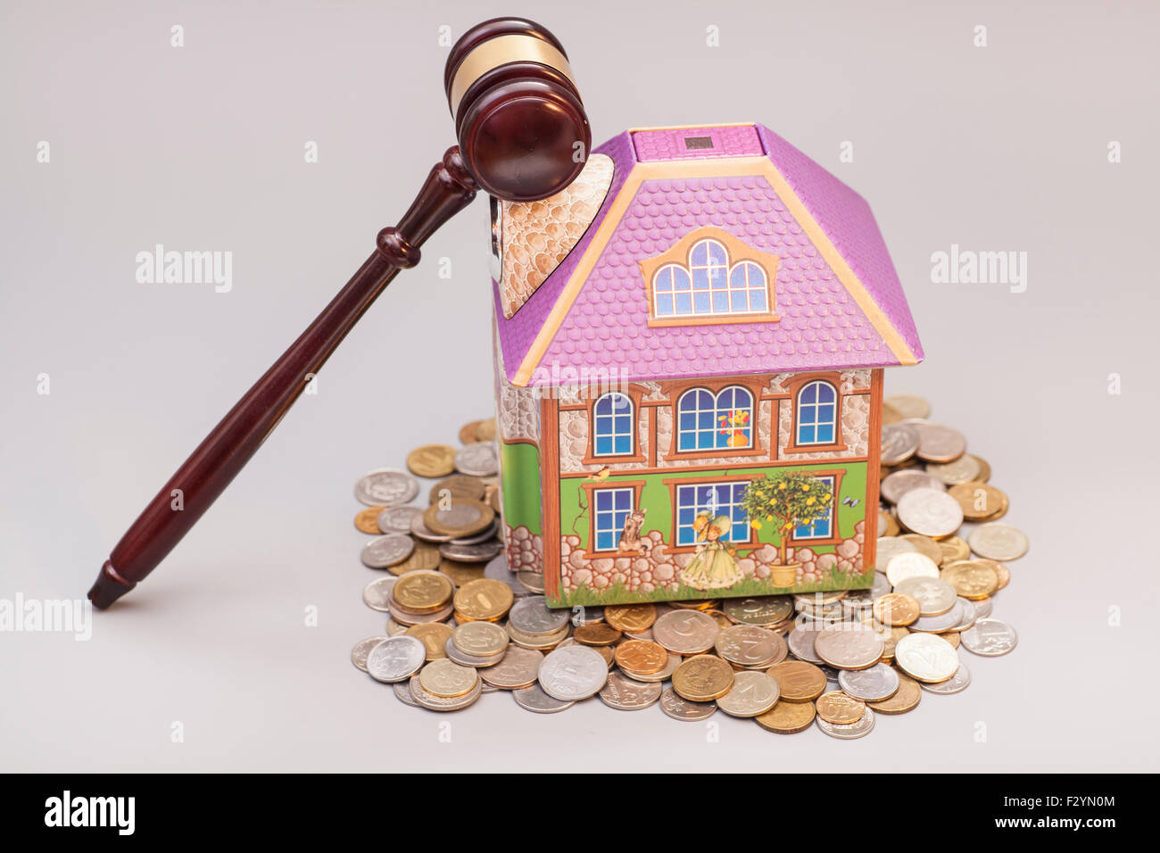 Home, coins and gavel isolated on gray.Real estate concept Stock Photo ...