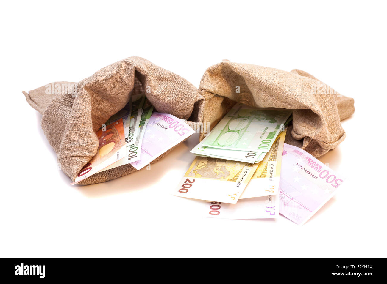 Two Money bags with euro isolated on white background Stock Photo - Alamy