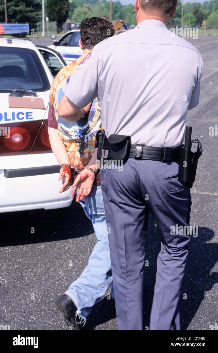 Police arrest a teen with an injured hand injured in a auto accident ...