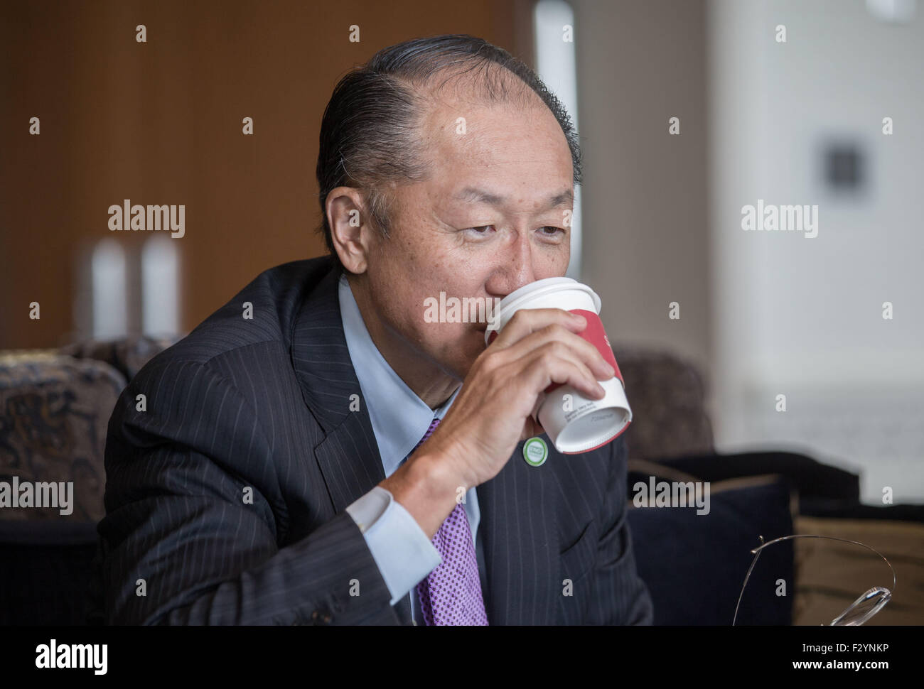 New York, USA. 25th Sep, 2015. World Bank president Jim Yong Kim drinks ...