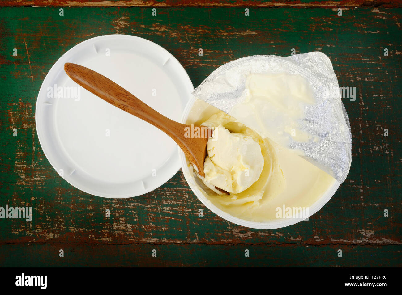 cream cheese in white plastic container Stock Photo - Alamy
