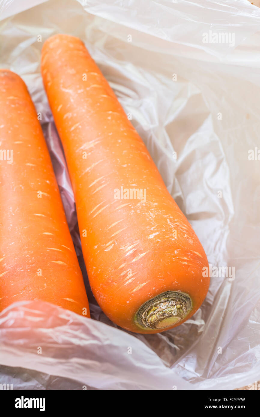 Fresh carrots on plastic hi-res stock photography and images - Alamy
