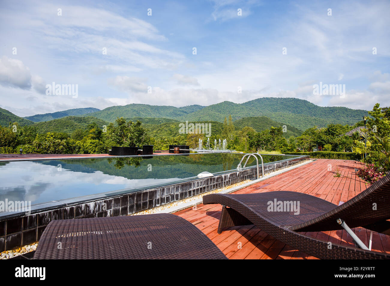 Swimming pool with mountain Stock Photo - Alamy