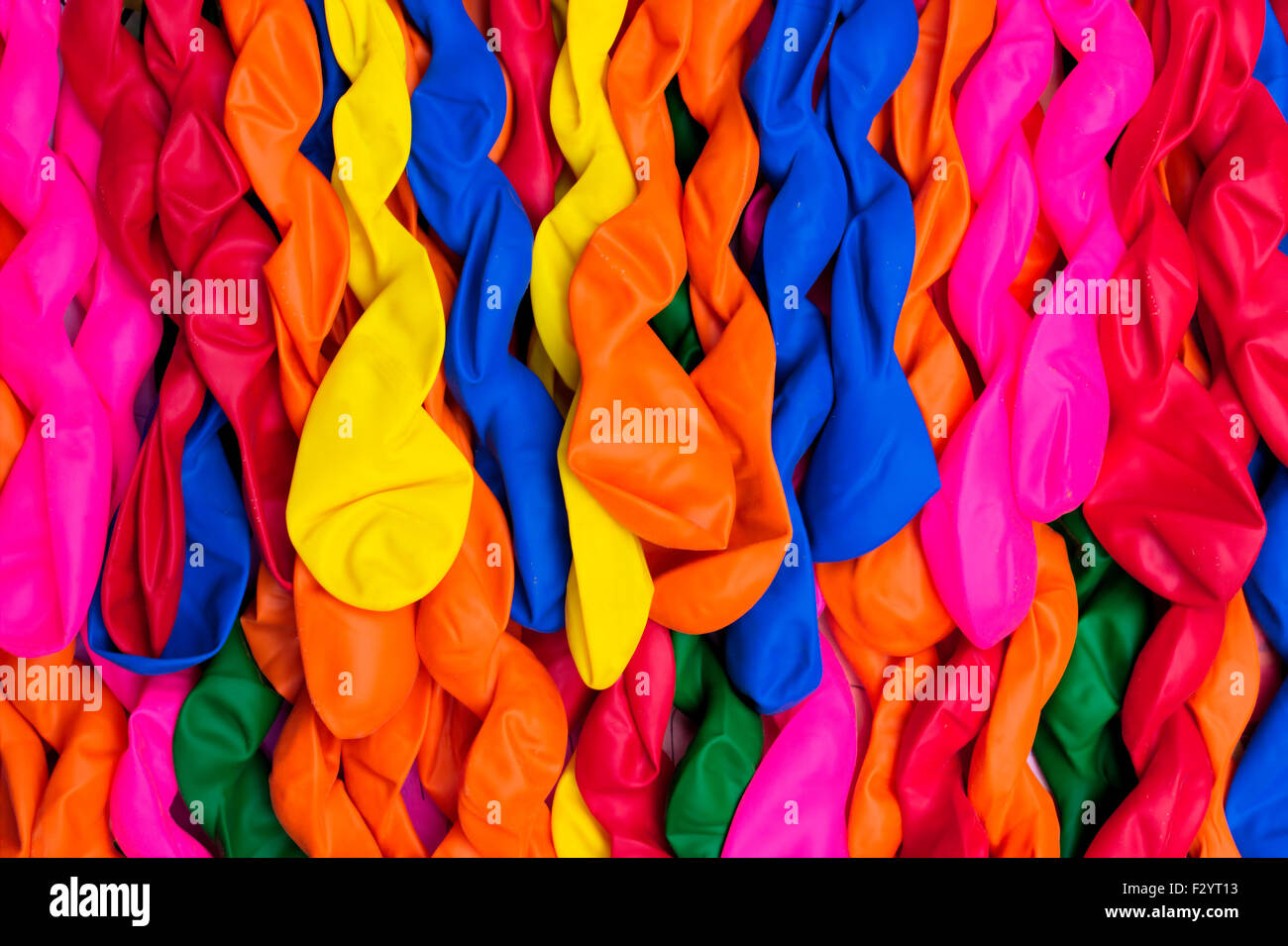 deflated color balloons creating texture Stock Photo - Alamy