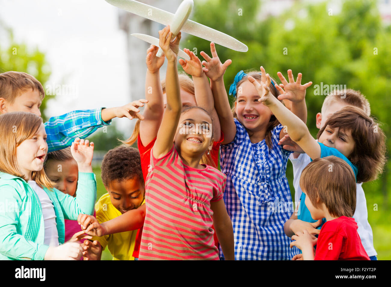 Close-up view of kids reaching after airplane toy Stock Photo - Alamy