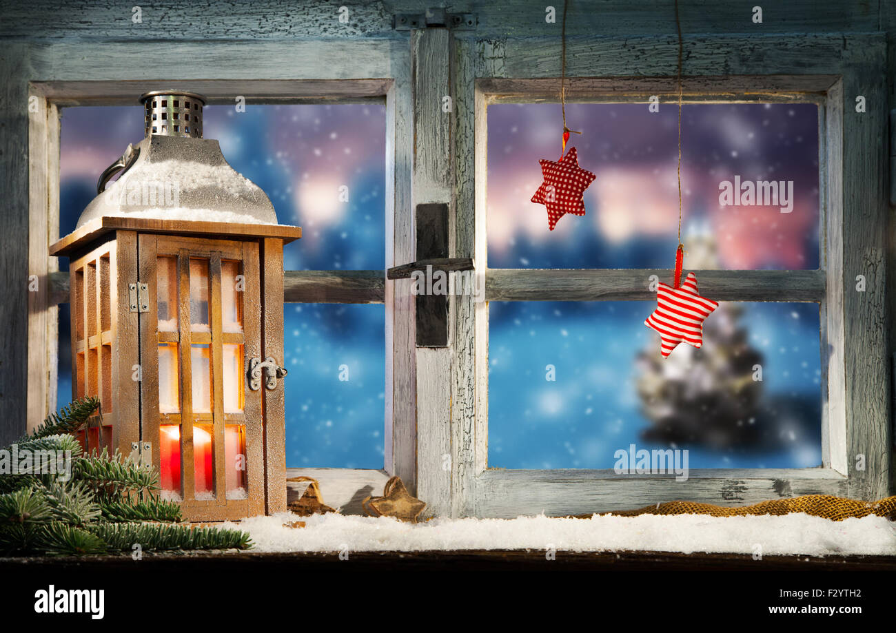 Lantern on window sill in winter Stock Photo - Alamy