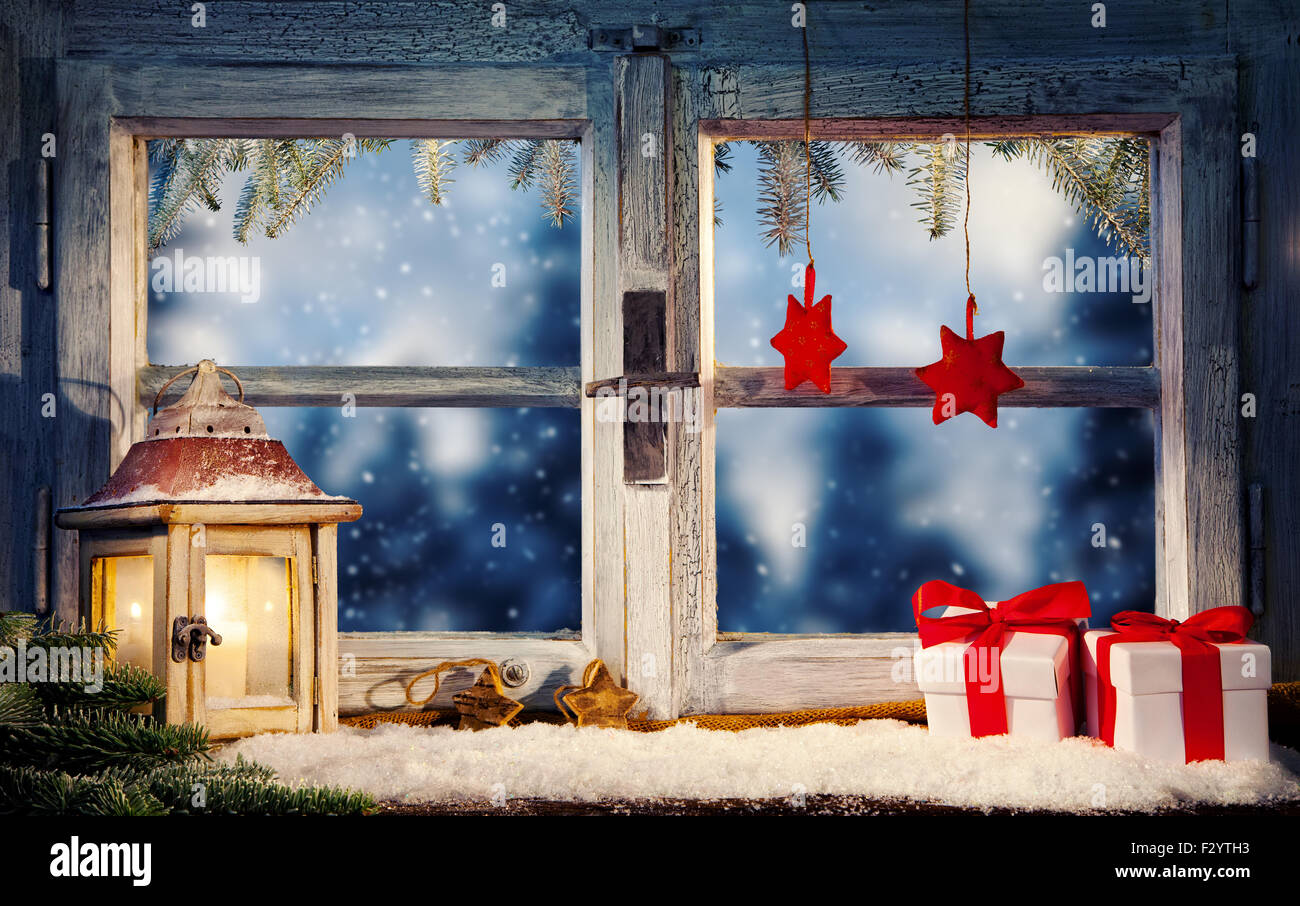 Lantern on window sill in winter Stock Photo - Alamy