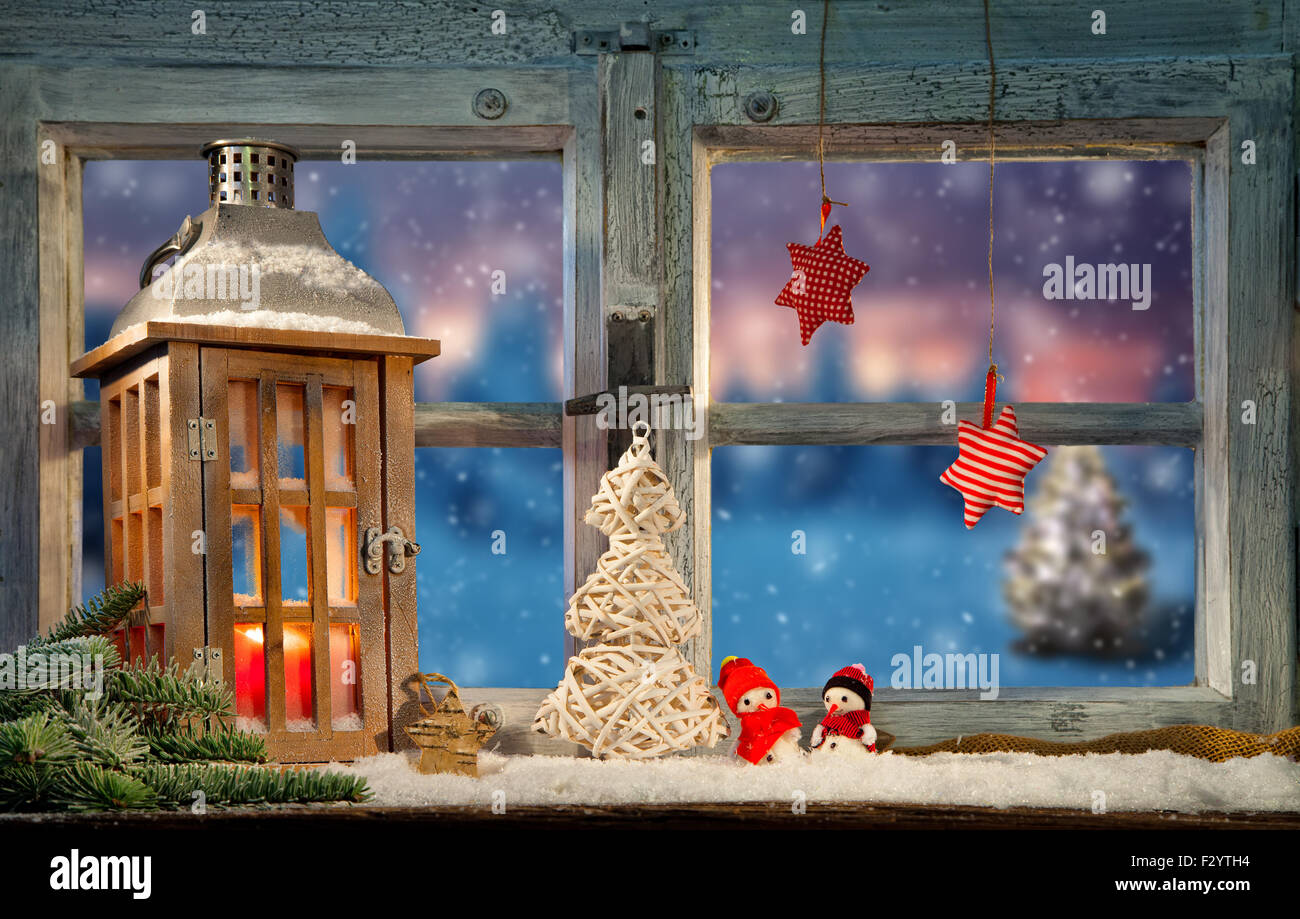 Lantern on window sill in winter Stock Photo - Alamy