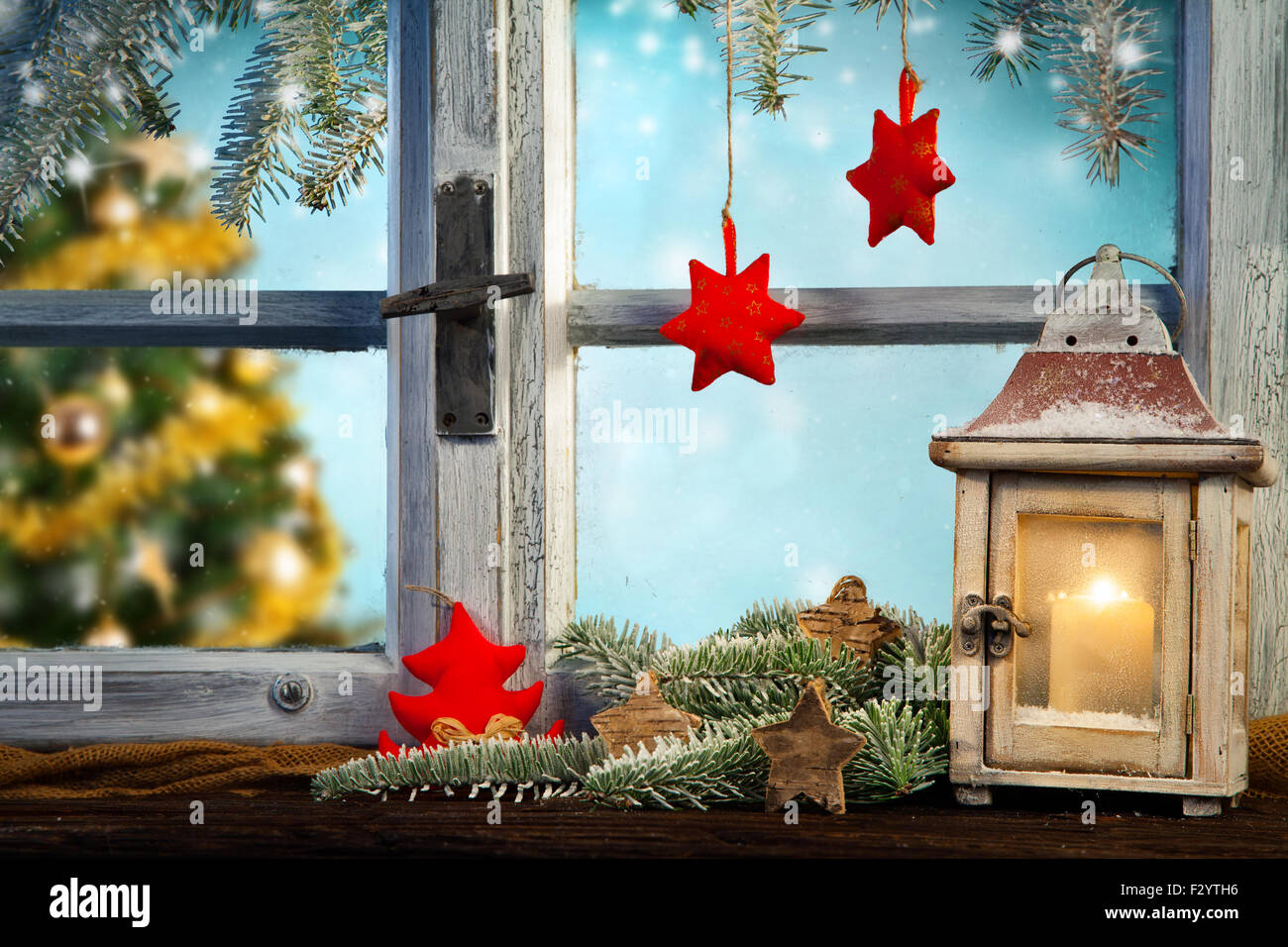Lantern on window sill in winter Stock Photo - Alamy