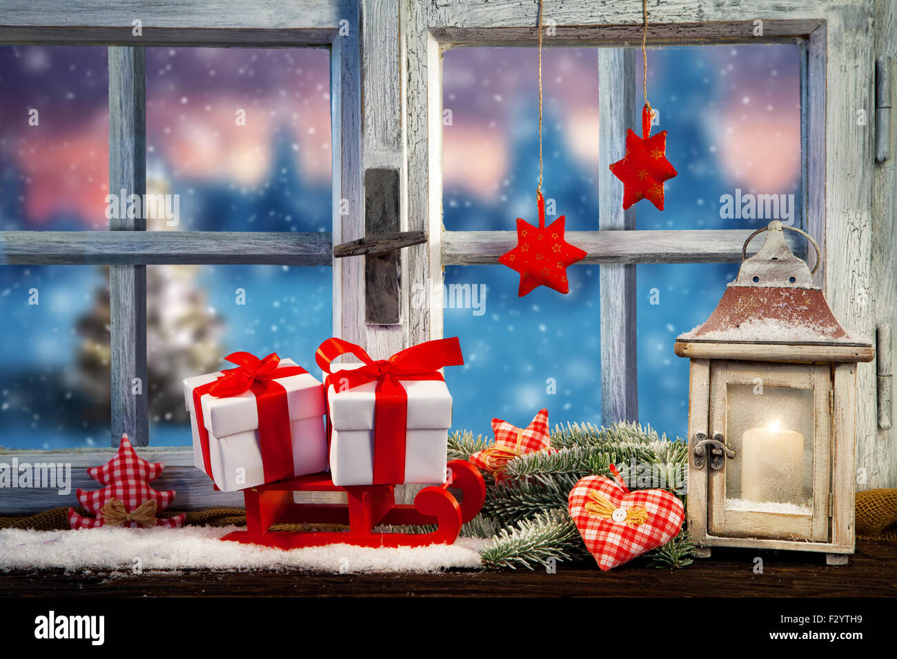 Lantern on window sill in winter Stock Photo - Alamy
