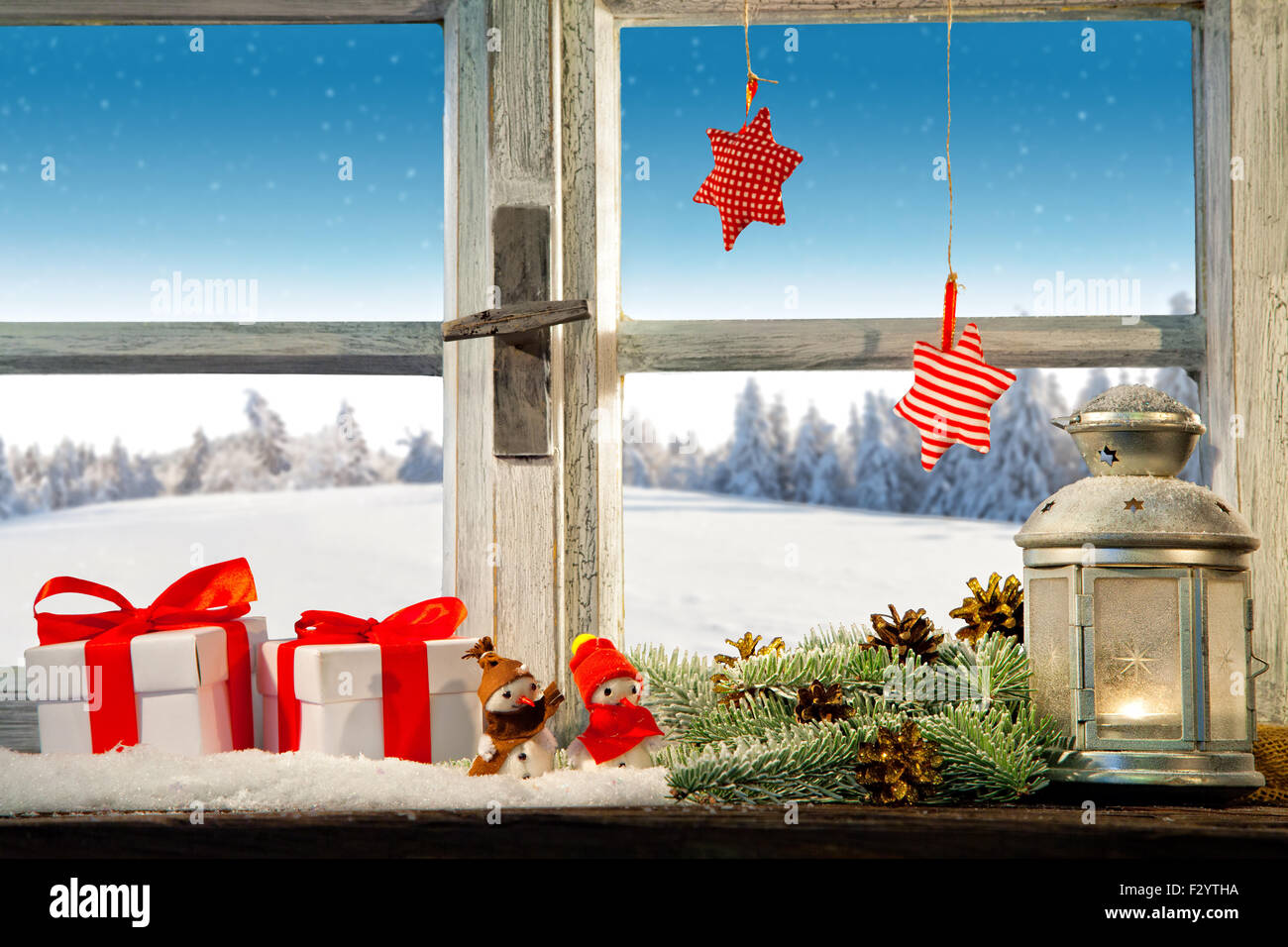 Lantern on window sill in winter Stock Photo - Alamy
