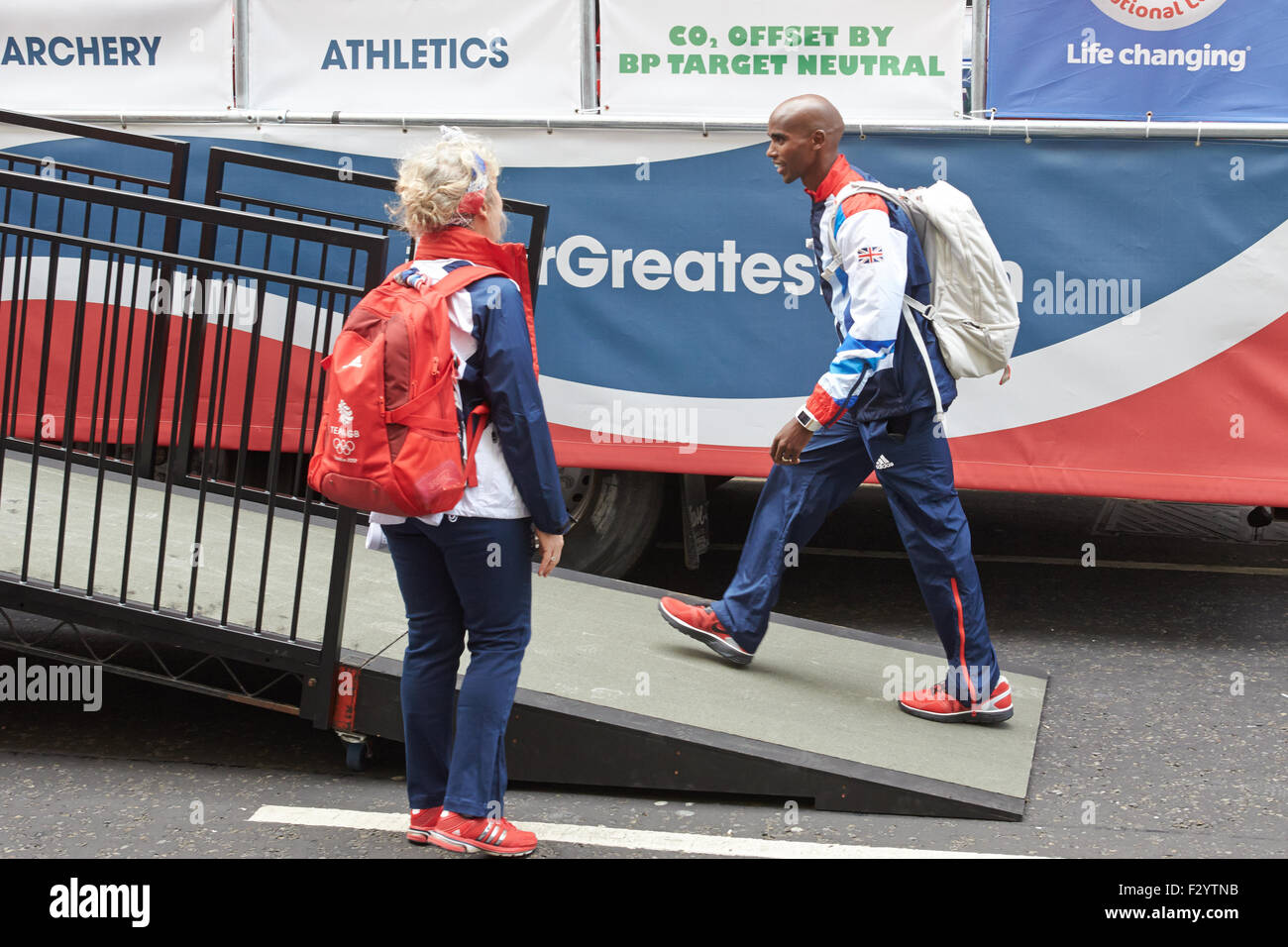 Mo Farah (R) boards his float ahead of the Olympic and Paralympic ...