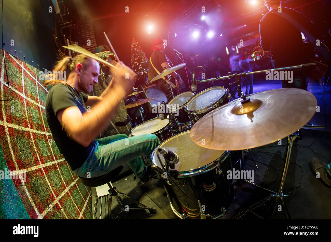 Drummer playing on drum set on stage. Warning - Focus on the drum ...